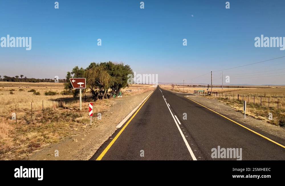 Isolated picnic stop on the side of a tar road in Africa, surrounded by ...
