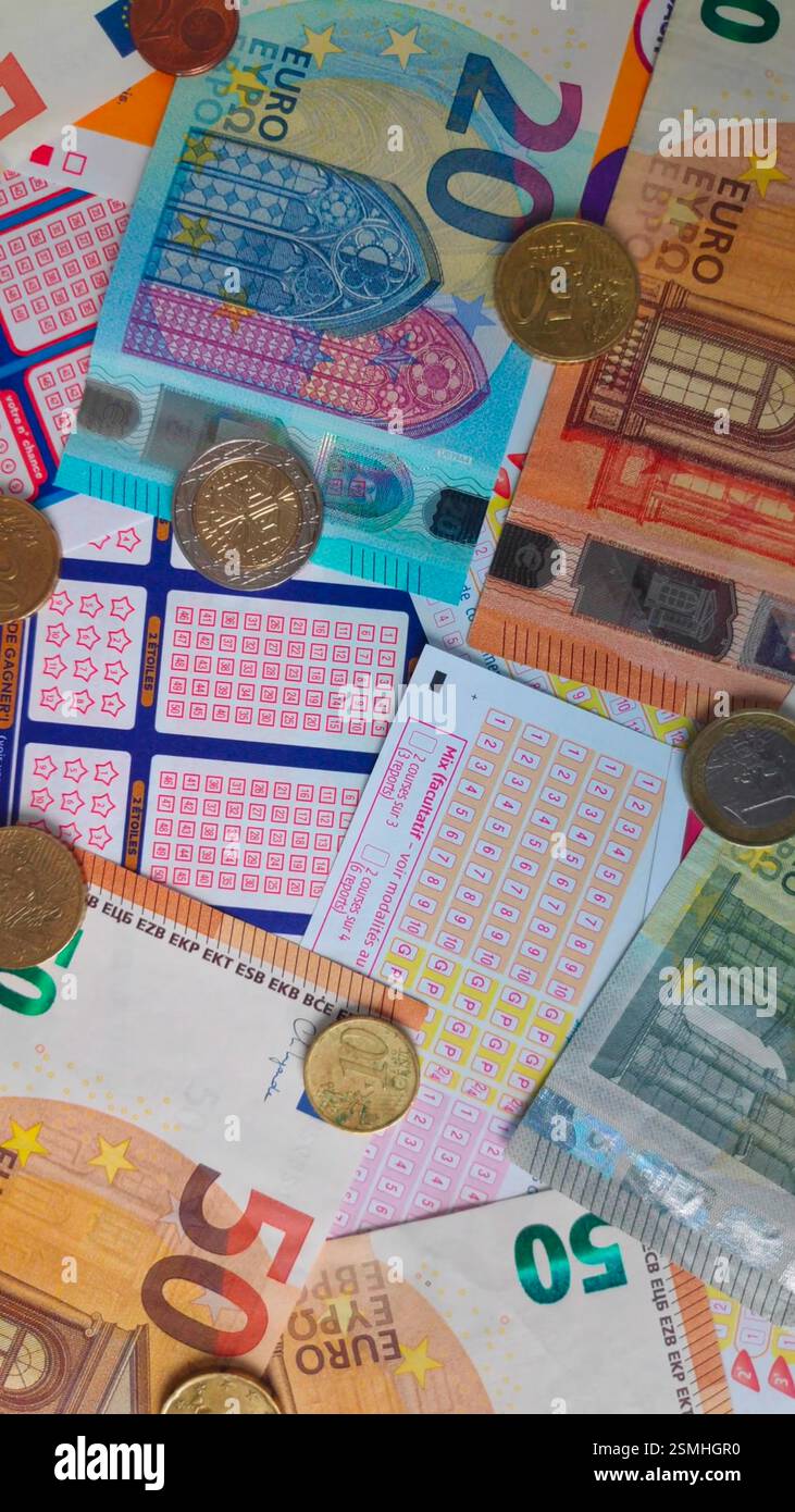 Stack of French grid of loto and gambling games with euro banknotes and ...