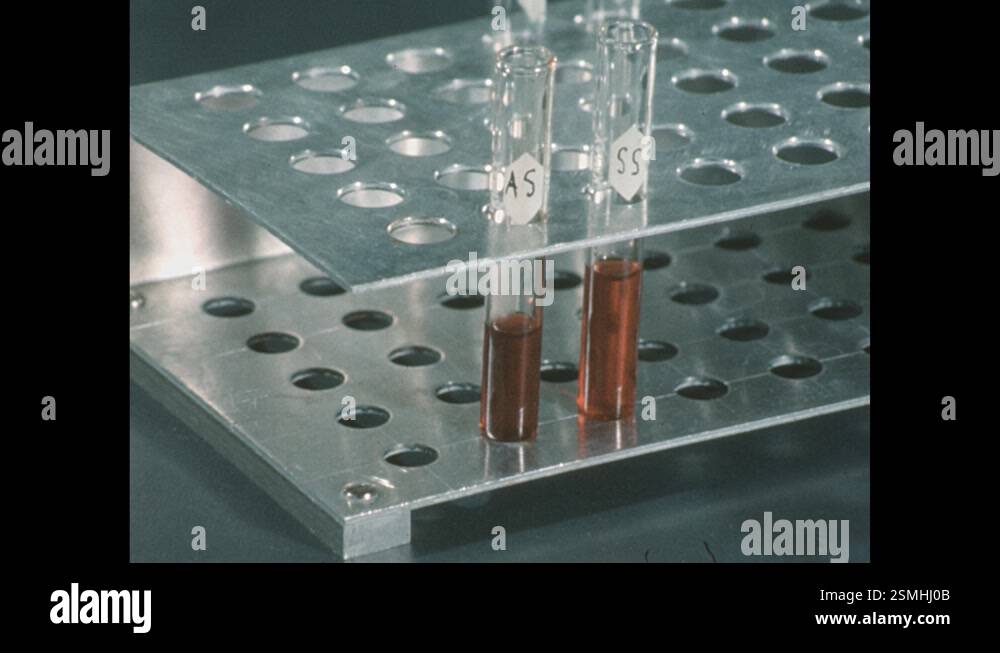 1960s: Liquids in three labeled test tubes. Person picks each one up ...