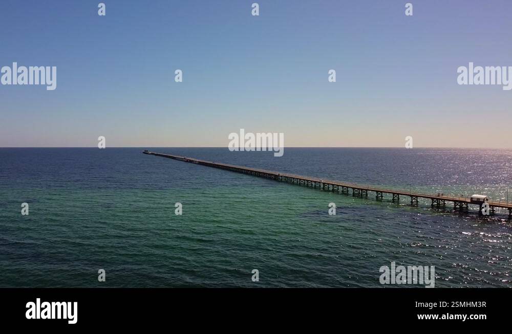 Busselton Jetty - Aerial view high alongside longest timber piled jetty ...