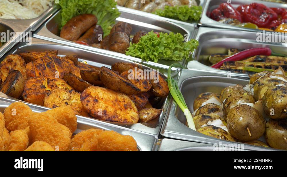 Various boiled, fried and deep-fried foods in fast food restaurant ...