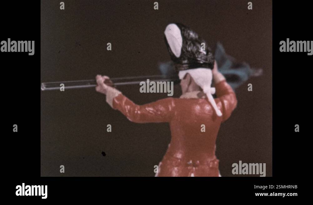 1960s: Toy soldier holds glass rod and stands on base of wax. Toy ...