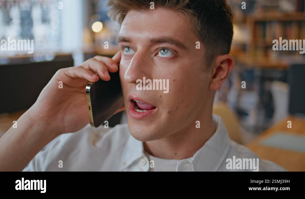 Relaxed coworker smartphone call speaking office closeup. Man mobile ...