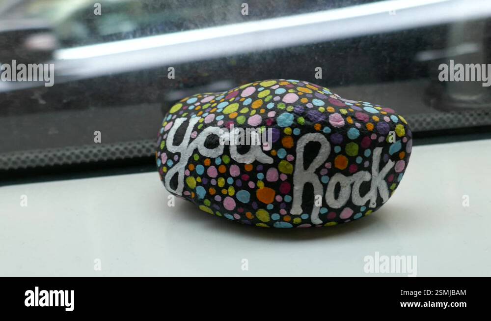 You rock kindness rock in window of fast moving public transportation ...
