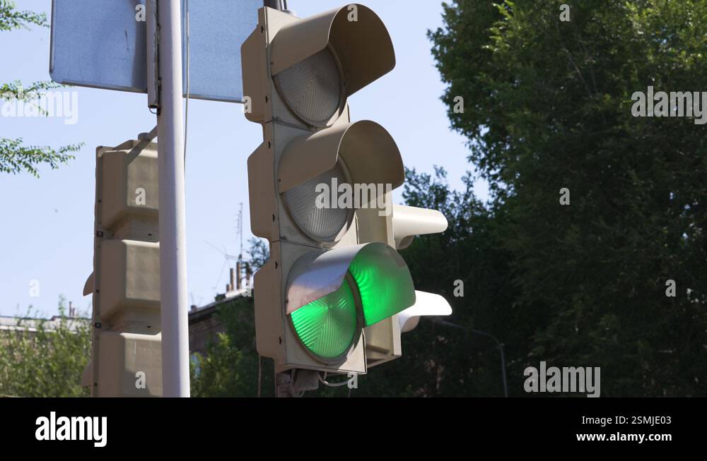 Traffic lights, traffic signs. Pedestrian traffic light from green to ...