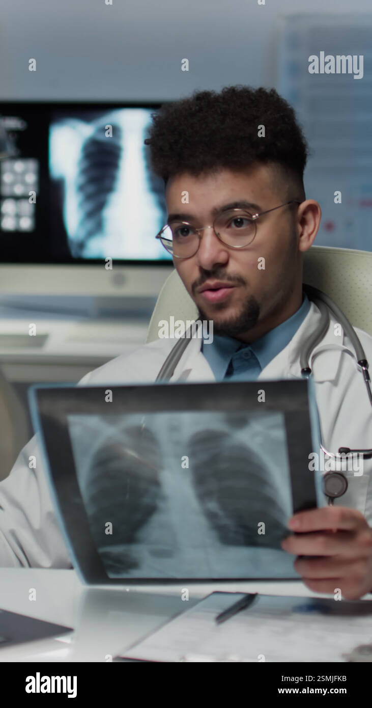 Vertical of Radiologist Making Diagnosis from Lung X-Ray during ...