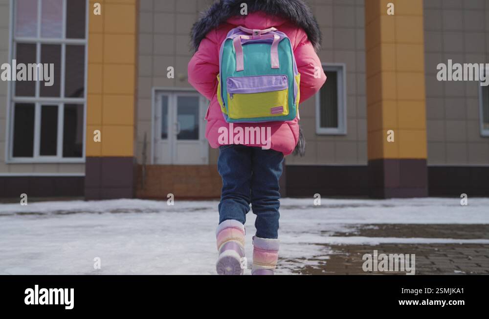 Child with backpack goes school first snow, girl kid daughter happy ...