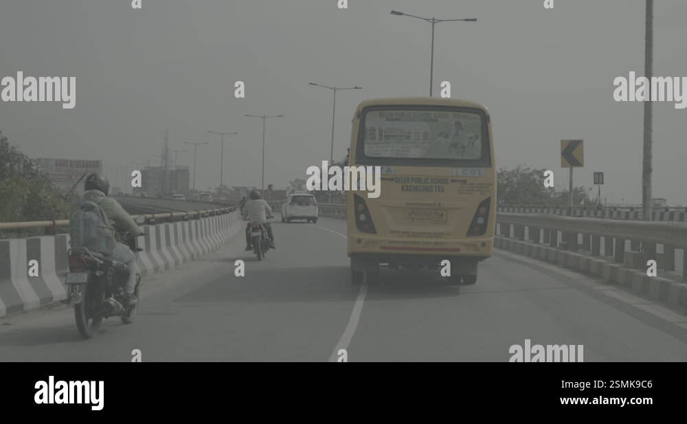 Varanasi, India. School bus in Traffic in Banaras. School bus carries a ...
