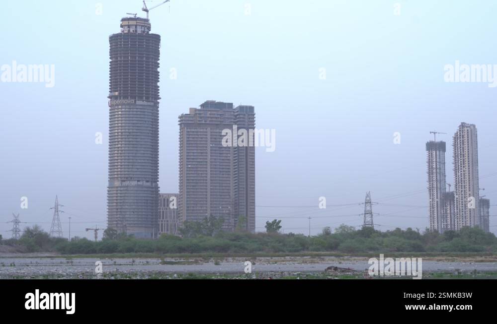 Skyscraper buildings construction across the Yamuna riverfront in ...