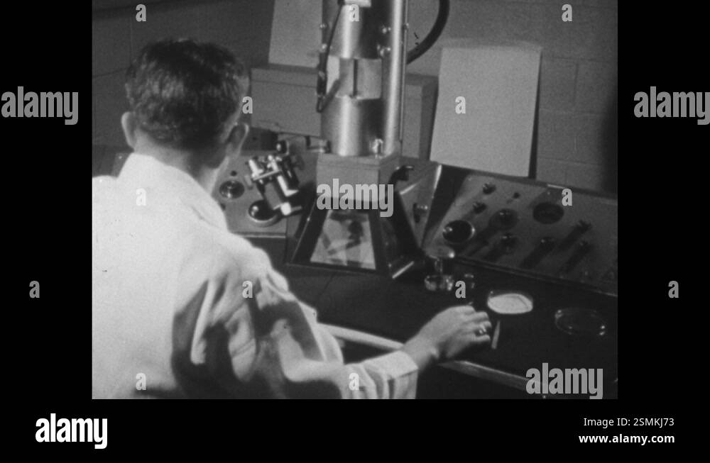 1960s: Scientist prepares slide and looks through microscope. Scientist ...
