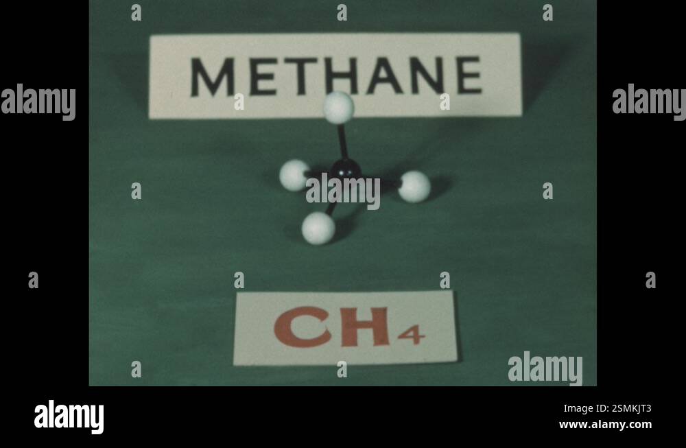 1940s: A hand holds a model of a methane molecule, with a card labeled ...