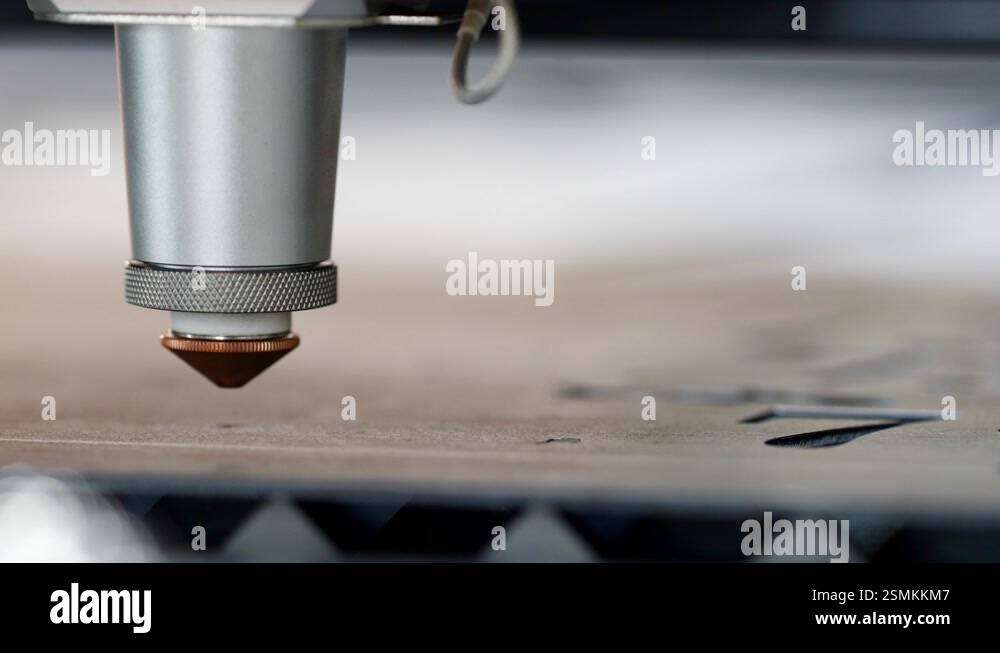 Laser cutter close-up, the process of cutting a metal part, a bright ...