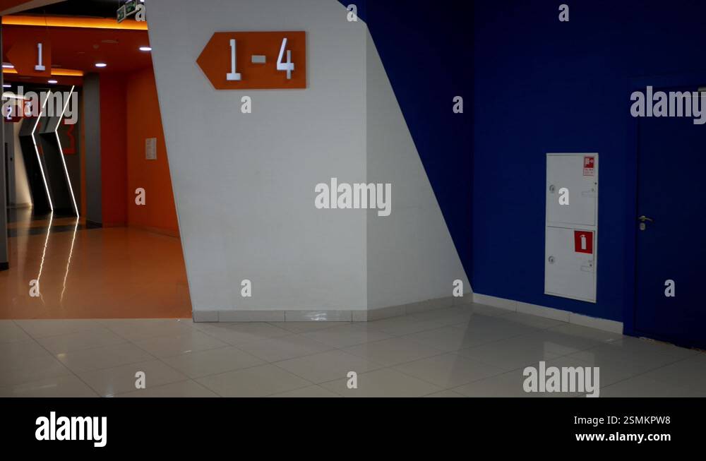 Emergency exit door and fire extinguisher at movie theater. Exit doors ...