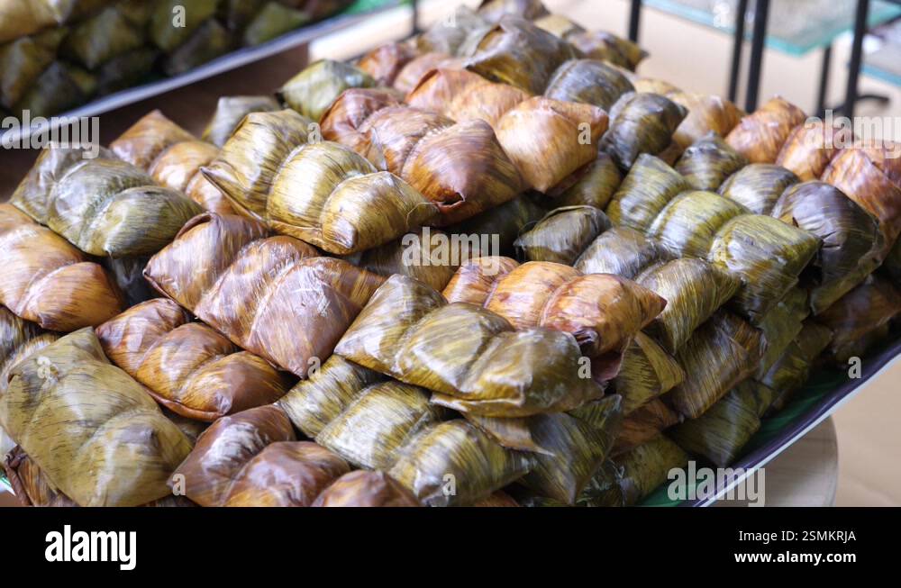 Thai Traditonal Dessert, Coconut Sticky Rice Cover with Banana Leaf ...