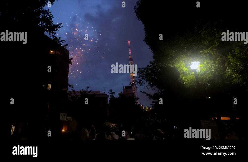Tokyo Tower lights up the night sky with a fireworks display in the Stock Video Footage - Alamy