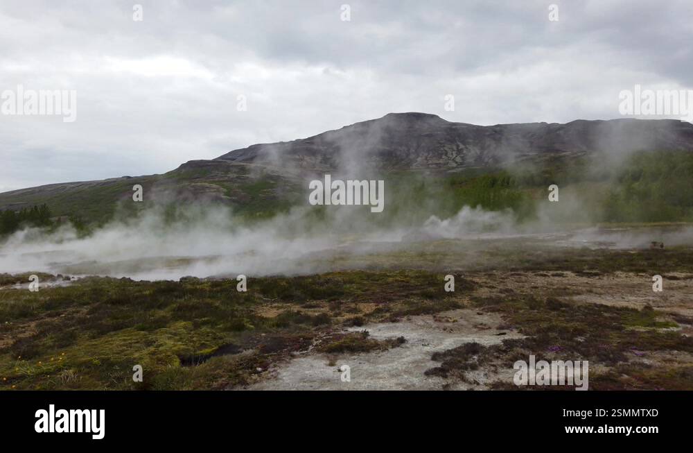 Geyser hot spring area with steam and boiling water, Iceland Stock ...