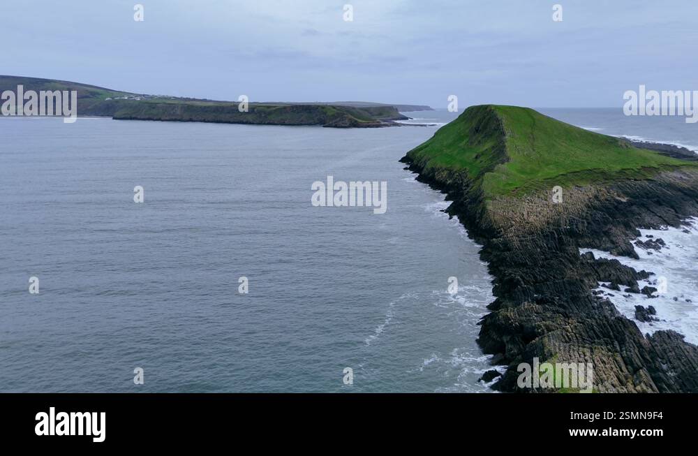 Flying along the spine of the dragon towards Worms head, Rhossili Bay Stock Video Footage - Alamy