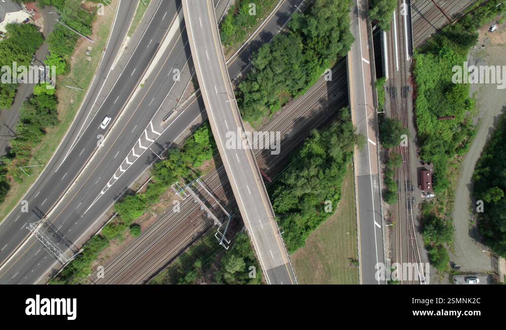 Overhead view of crossing highways, bridges and train lines in New ...