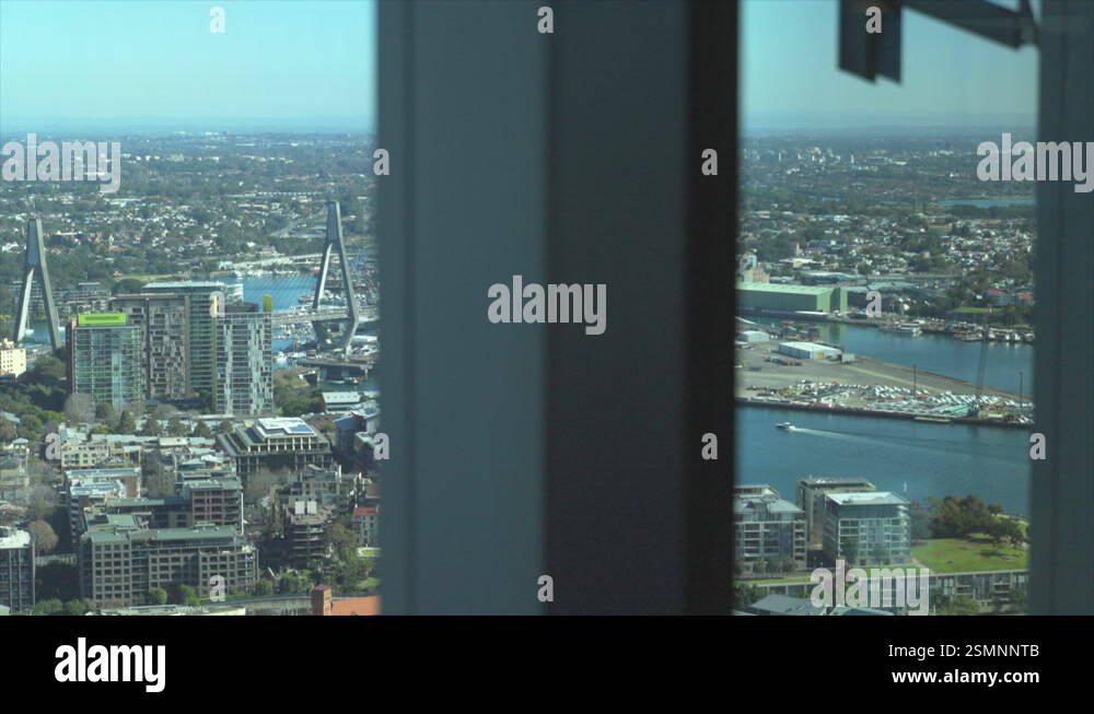 Handheld POV of Anzac bride from a window in Barangaroo, Sydney ...