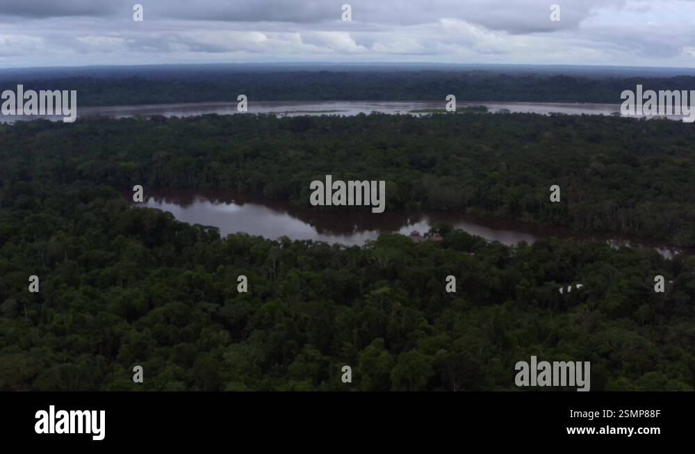 Drone flight circling a hotel in the amazon rainforest in Colombia ...