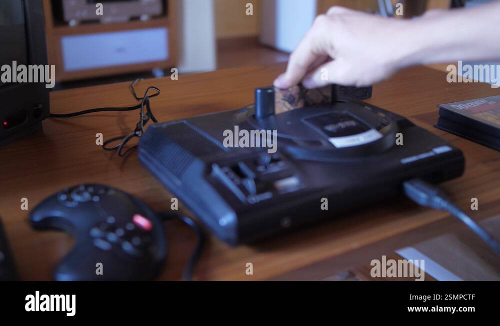 turn on put cartridge and grab controller retro vintage sega mega drive genesis Stock Video ...