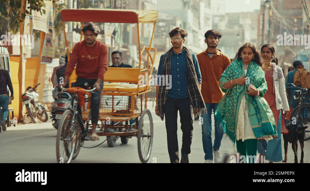 Varanasi, India. People Walk Along Busy Street. Man Rickshaw Driver ...
