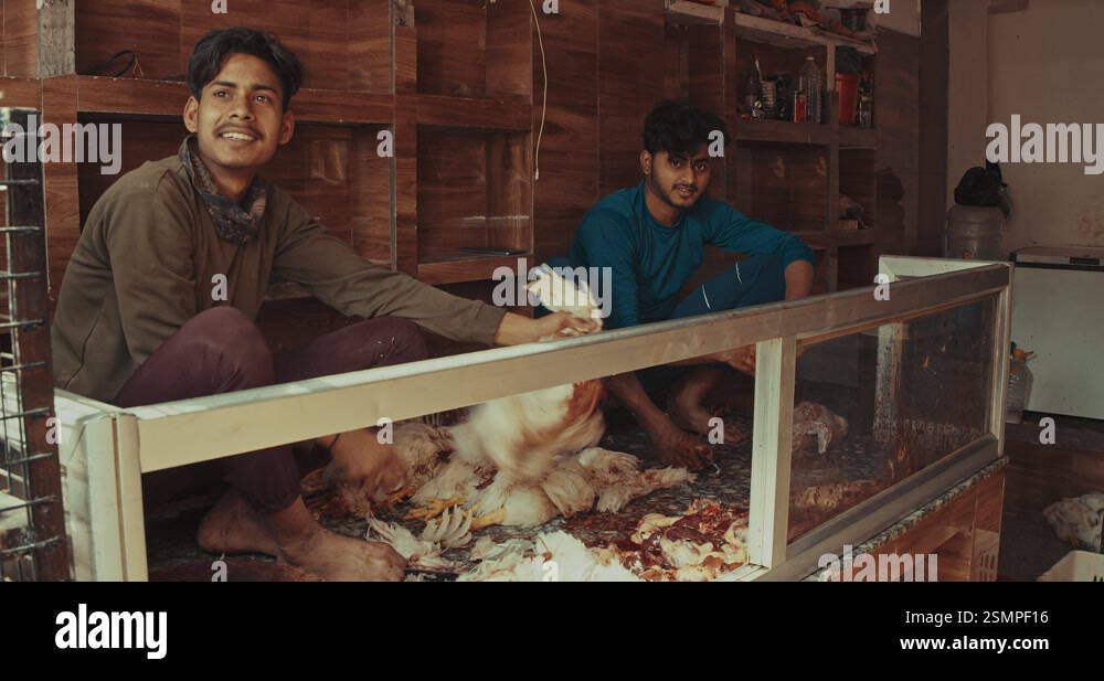 Varanasi, Uttar Pradesh, India. Men Plucking Chickens. Plucking Fresh ...
