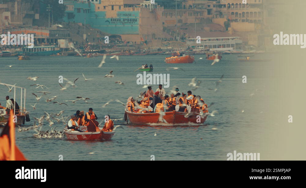 Varanasi, India. Tourists And Pilgrims Floating On Ganga Riverbank ...