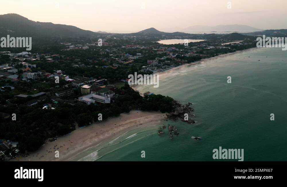 Dawn light breaks over Koh Samui Chaweng Beach at dawn with calm ocean ...