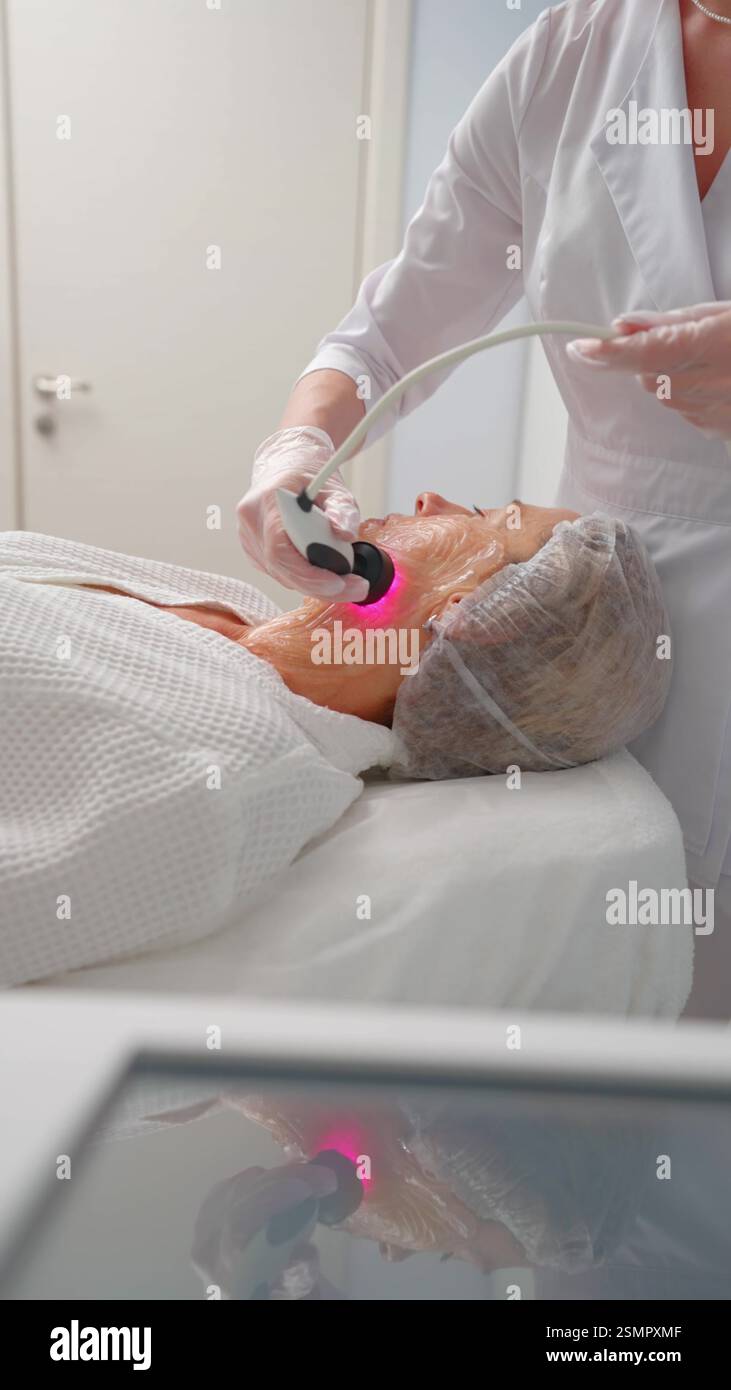 Woman Getting Fractional Microneedle RF Face Lifting Procedure in ...