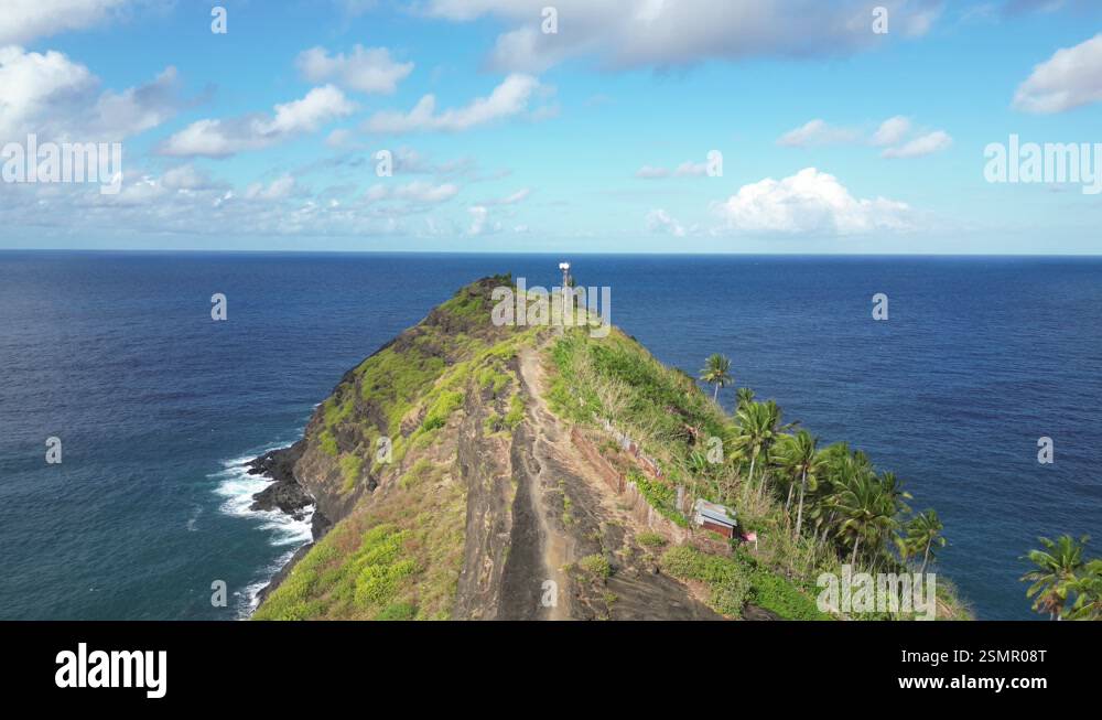 drone fly above strip of land ocean cliff rock formation in Indian ...