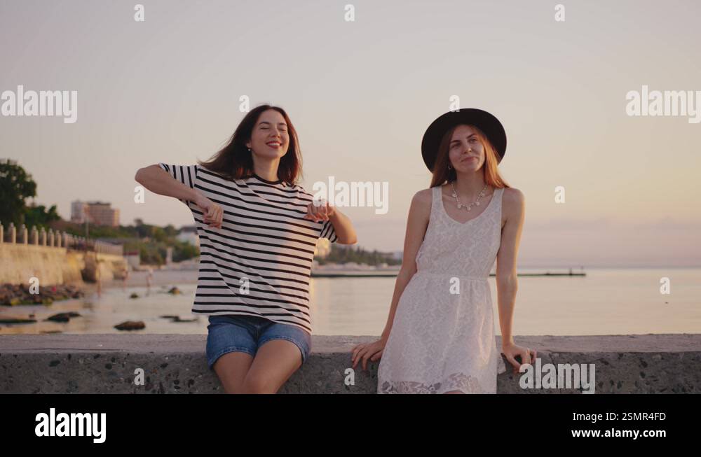 Two friends are enjoying a delightful and picturesque stroll together ...