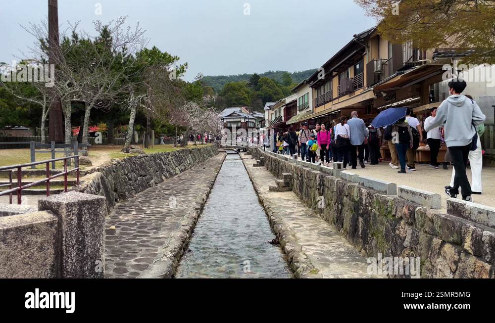 Hiroshima, Japan - 03/02/2024: Centered shot of creek in a paved canal ...