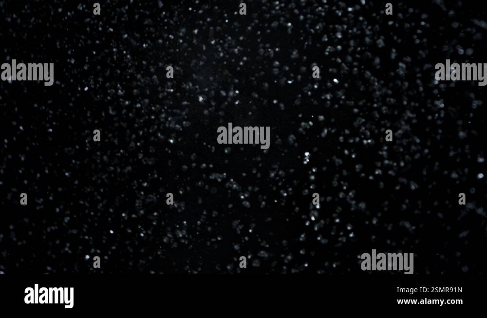 Super Slow Motion Shot of Glittering Particle Background with Camera ...