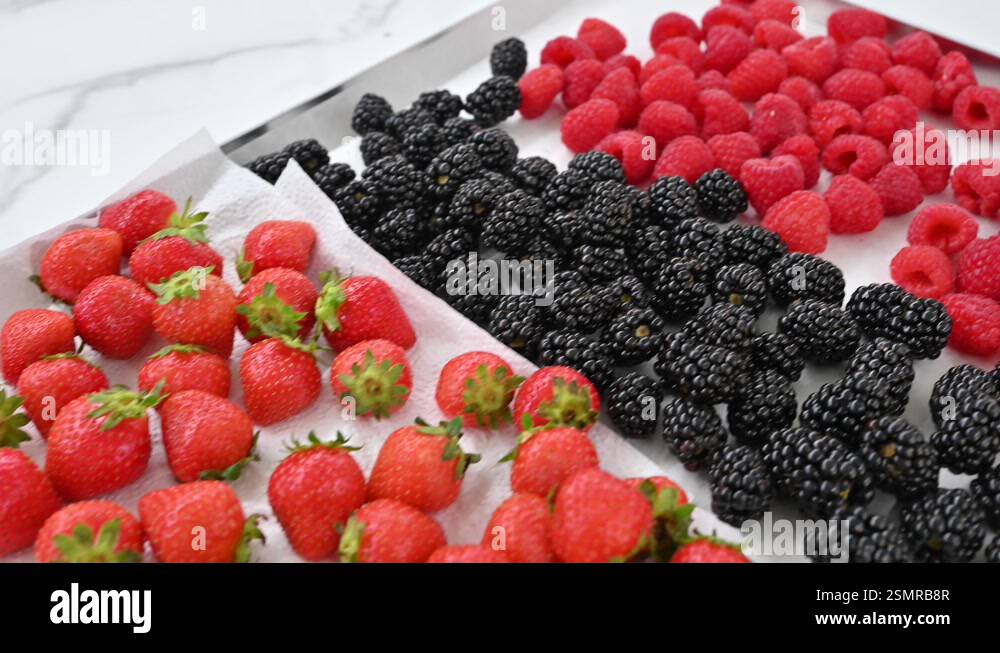 A selection of berries on display for decorating cakes and muffins at a ...