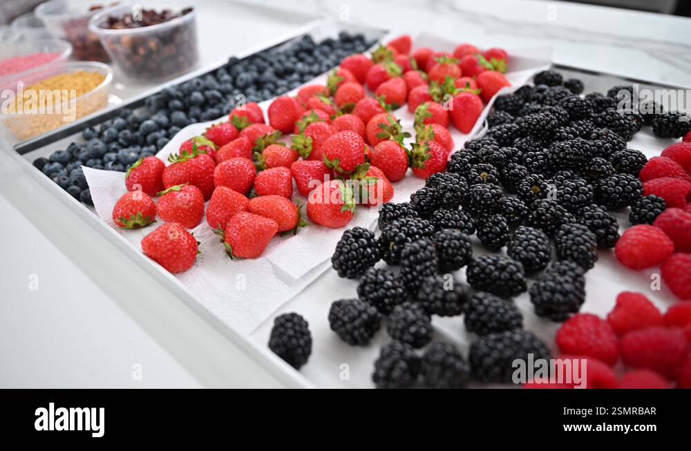 various types of berries arranged for use as toppings on cakes and ...