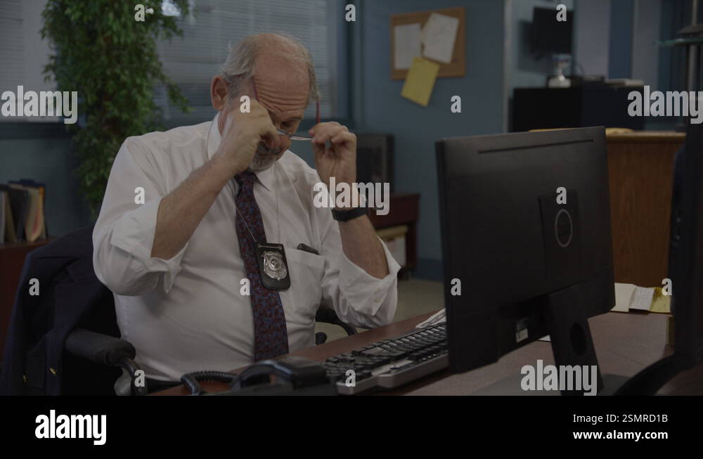 Frustrated police officer takes off glasses Stock Video Footage - Alamy