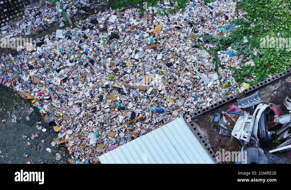 Drainage ditch polluted with human garbage in Herrera neighborhood ...