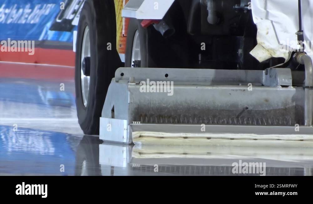 A close up to a Zamboni machine resurfacing an ice rink Stock Video ...