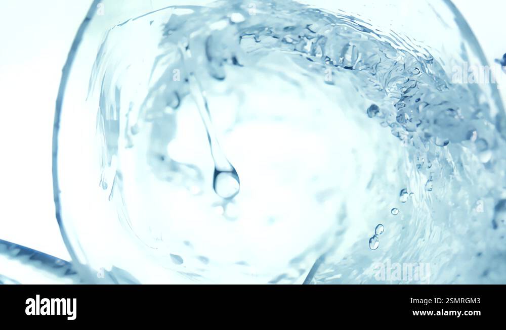 Water fly against to the camera on a black background in slow motion ...