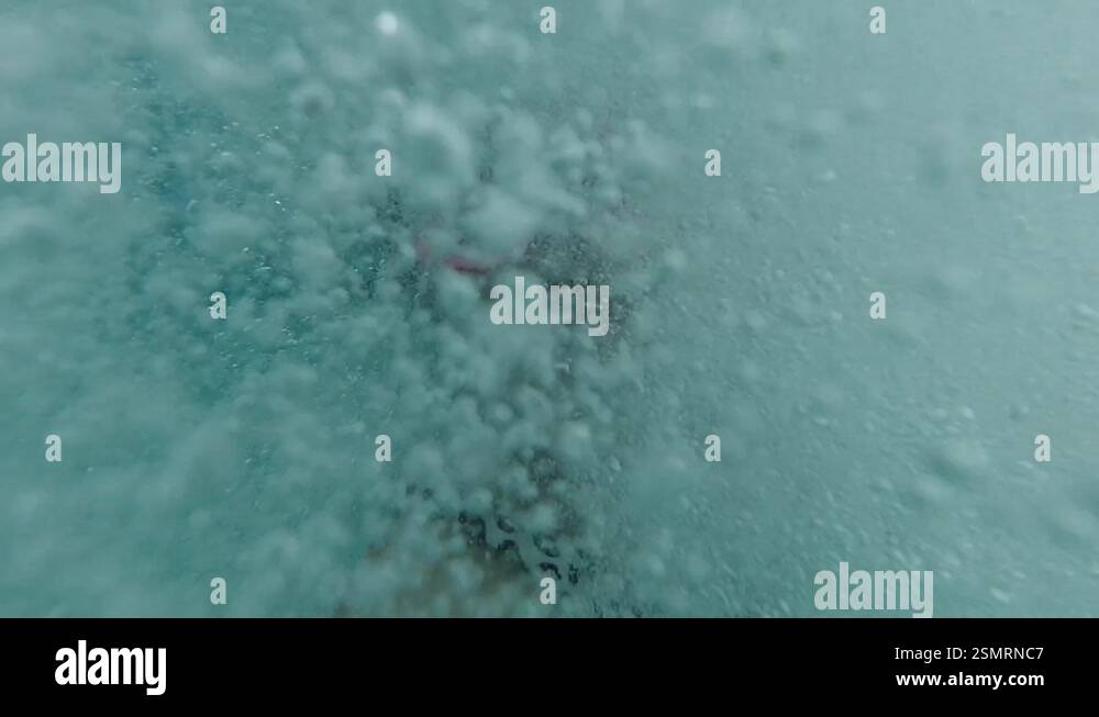 Underwater scene with bubbles floating all around, revealing a female in Stock Video Footage - Alamy