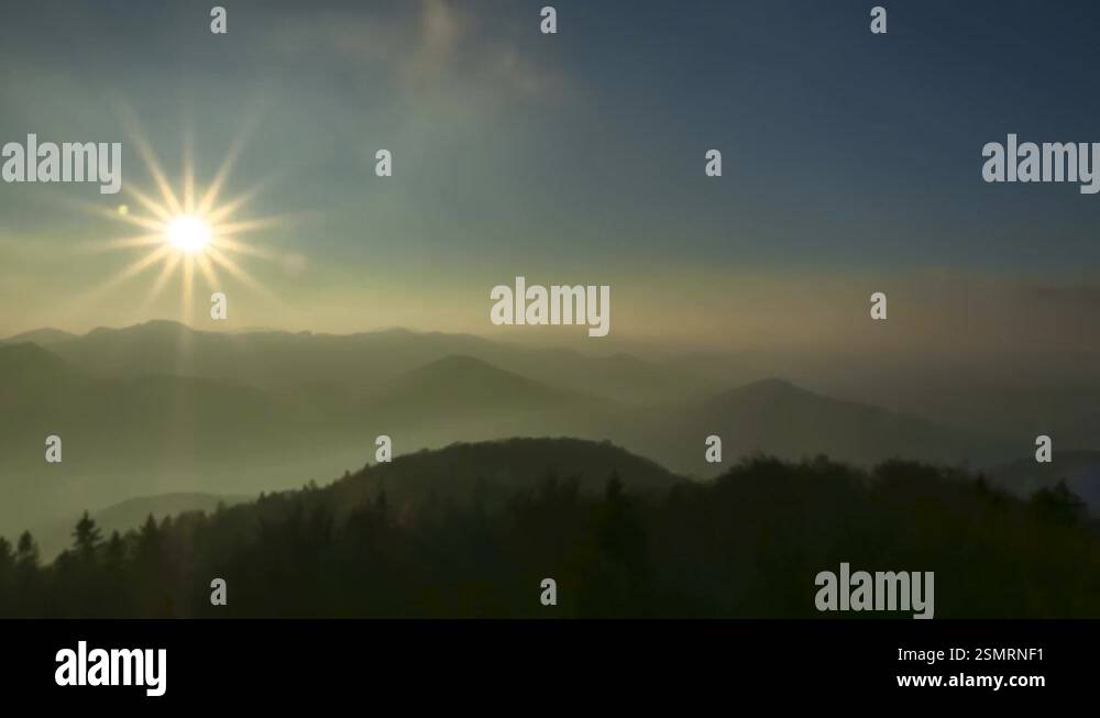 Footage shows a timelapse or time lapse of sun setting or of a sunset ...