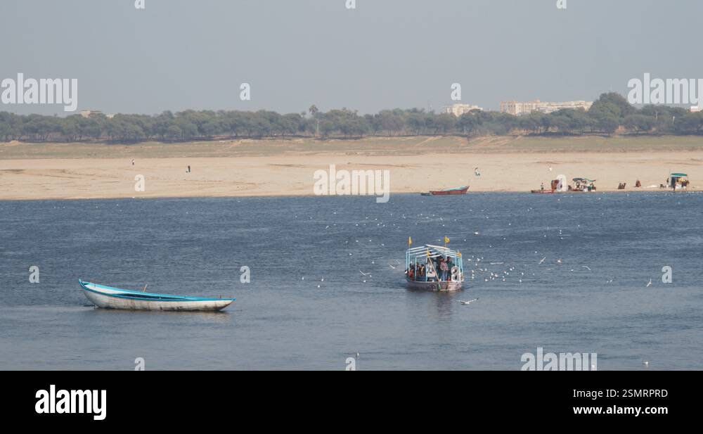 Varanasi, India. Tourists And Indian Pilgrims Floating On Ganga River ...