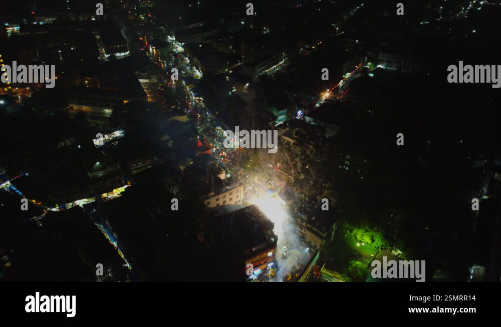 Drone bird's-eye view of nighttime event celebration with fireworks in ...