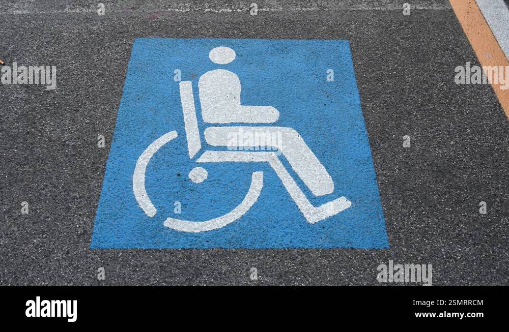 Parking space sign reserved for person with disability on the street ...