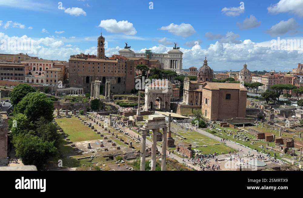 Rome, Italy - 05/20/2024: Tourists walk through ruins of ancient Rome ...