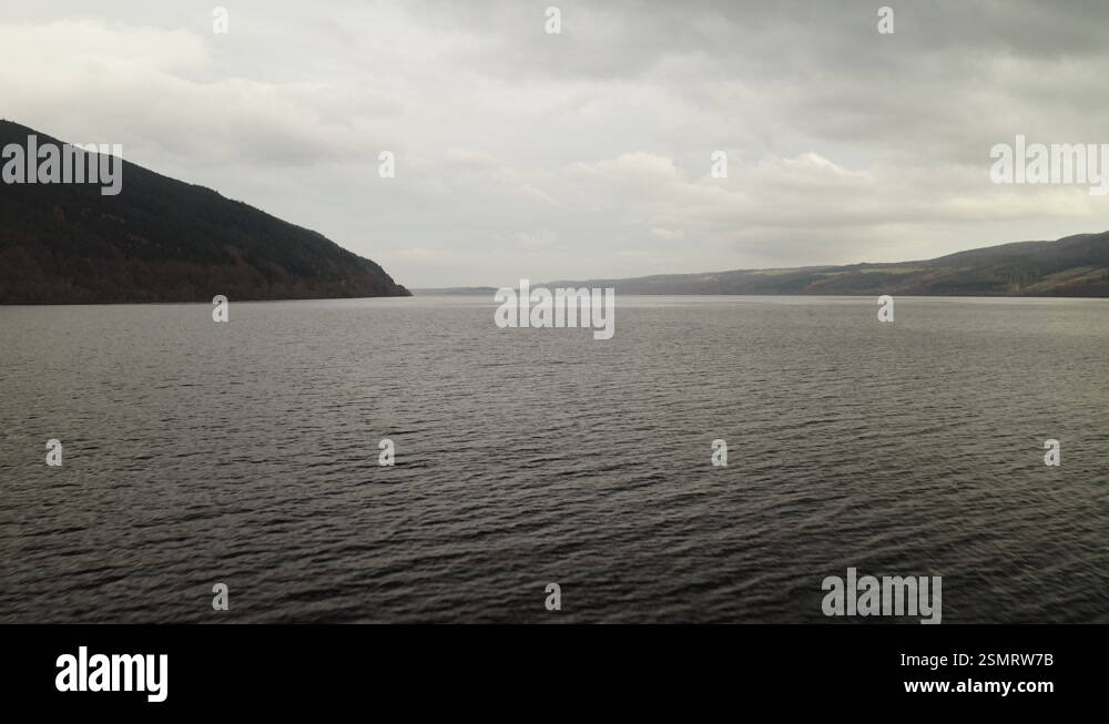 Aerial establishing dolly above Loch Ness in the Scottish Highlands ...