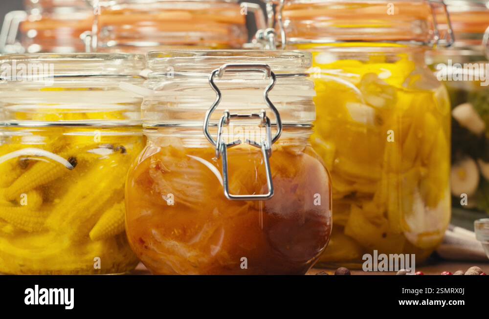 Fermented food in glass cans on table close-up. Preservation of ...