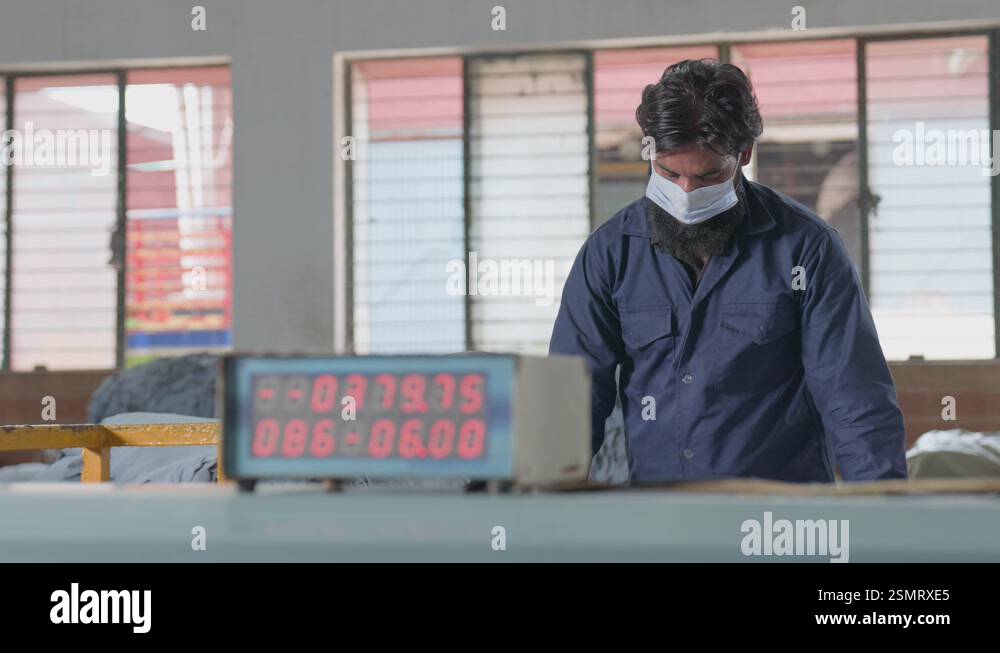 Lahore, Pakistan - 05/04/2024: Male Worker Sorting Animal Hides In A ...