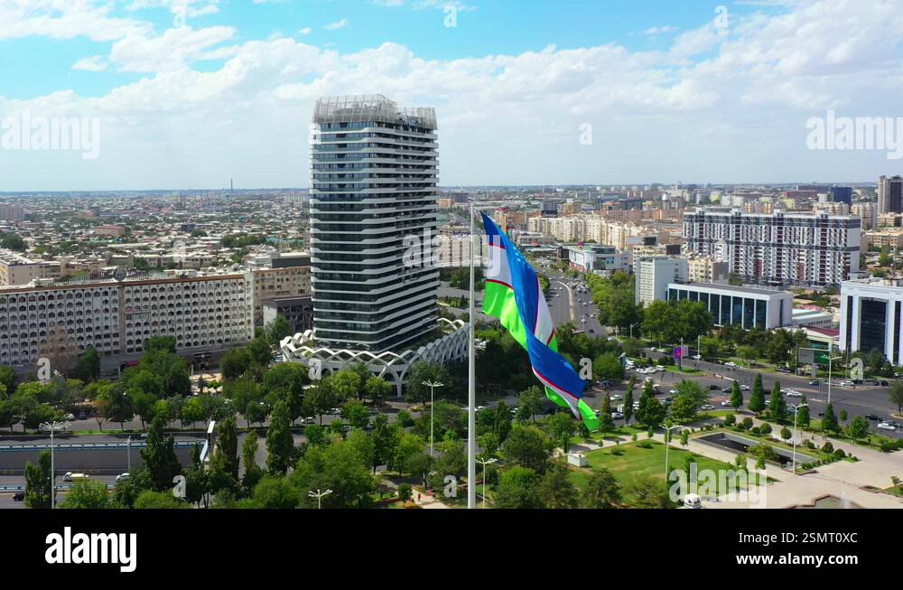 Uzbekistan Flag Waving Over Tashkent Cityscape Stock Video Footage - Alamy